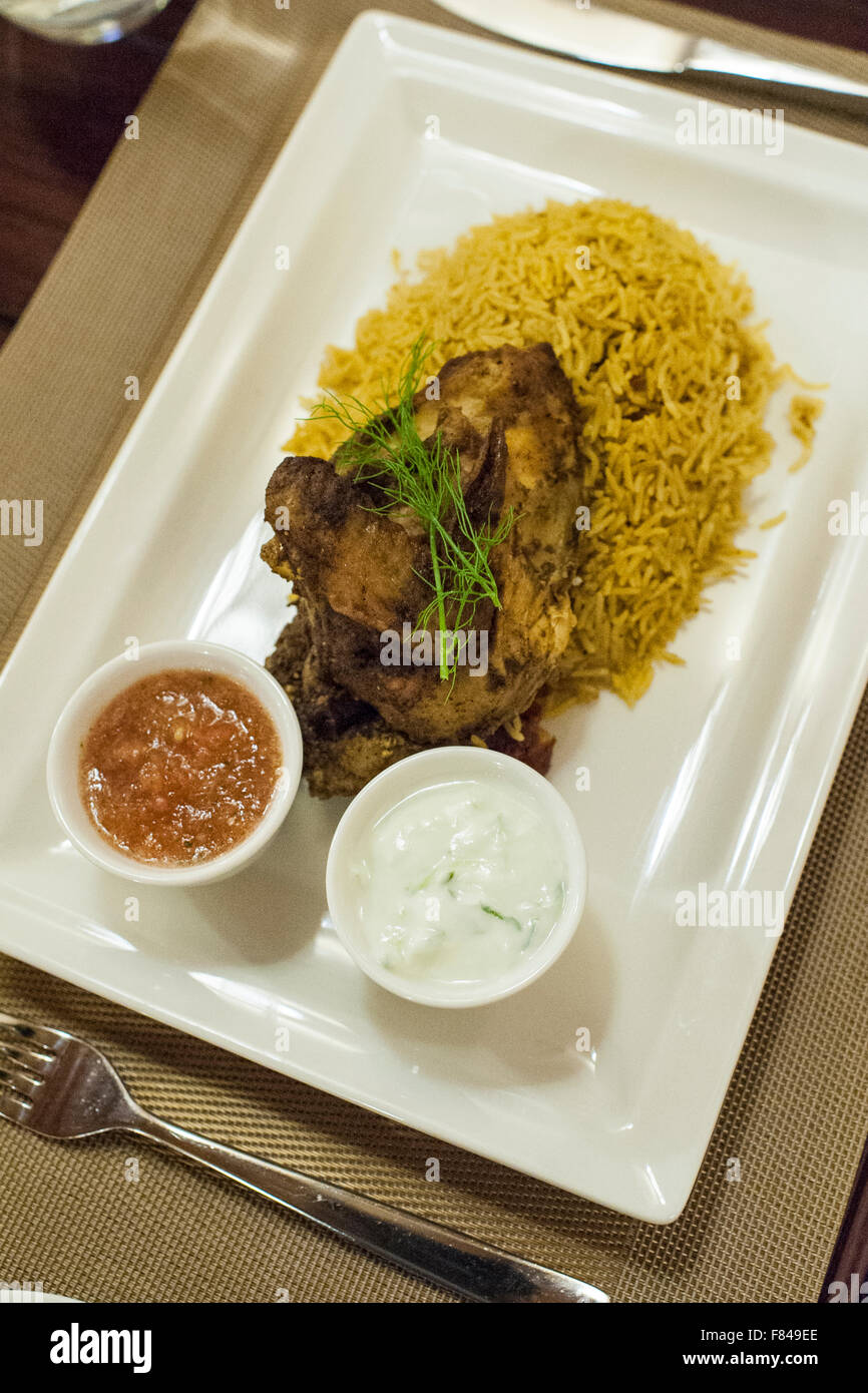 Makbus Dijaj, a traditional Omani dish of roasted chicken Stock Photo ...