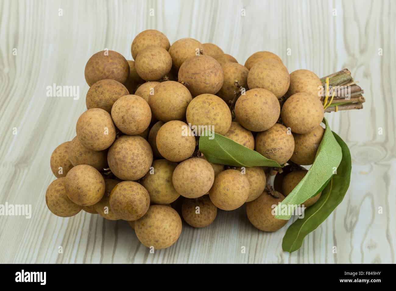 Asian fruit Longan - on wood background Stock Photo - Alamy