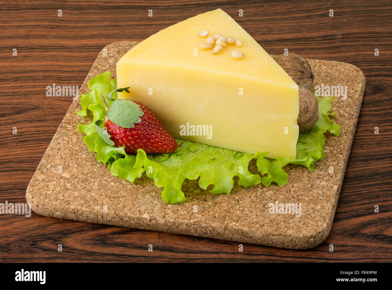 Parmesan cheese triangle with strawberry and wallnuts Stock Photo - Alamy