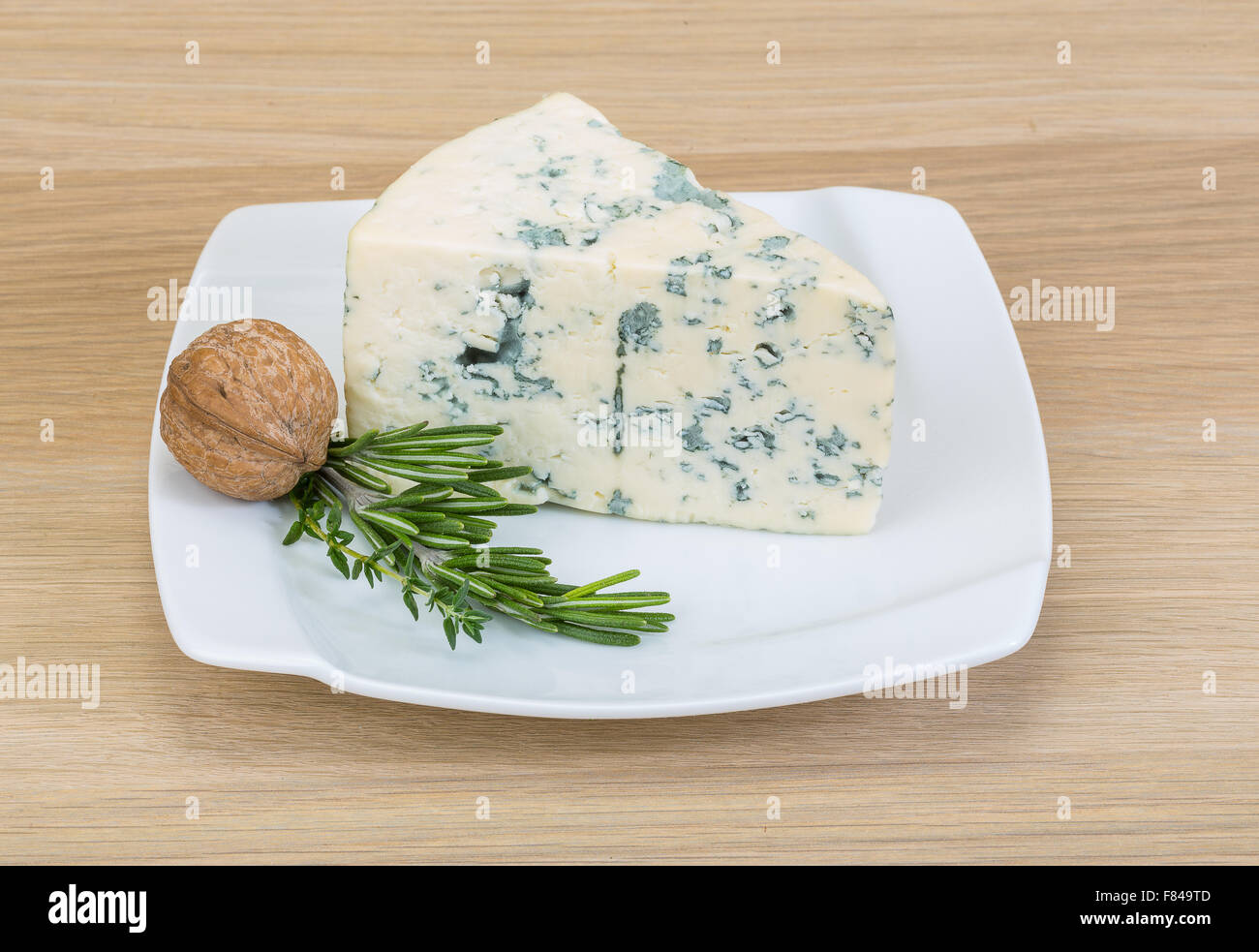 Blue cheese with mold on the wood background Stock Photo - Alamy