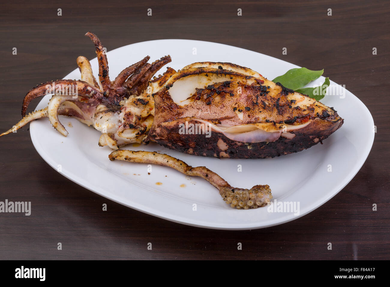 Grilled cuttlefish with spices in the bowl Stock Photo - Alamy