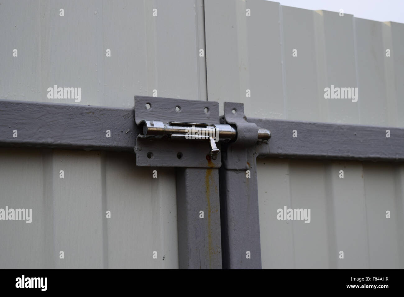 Latch on gate. A design for locking of gate from within Stock Photo - Alamy