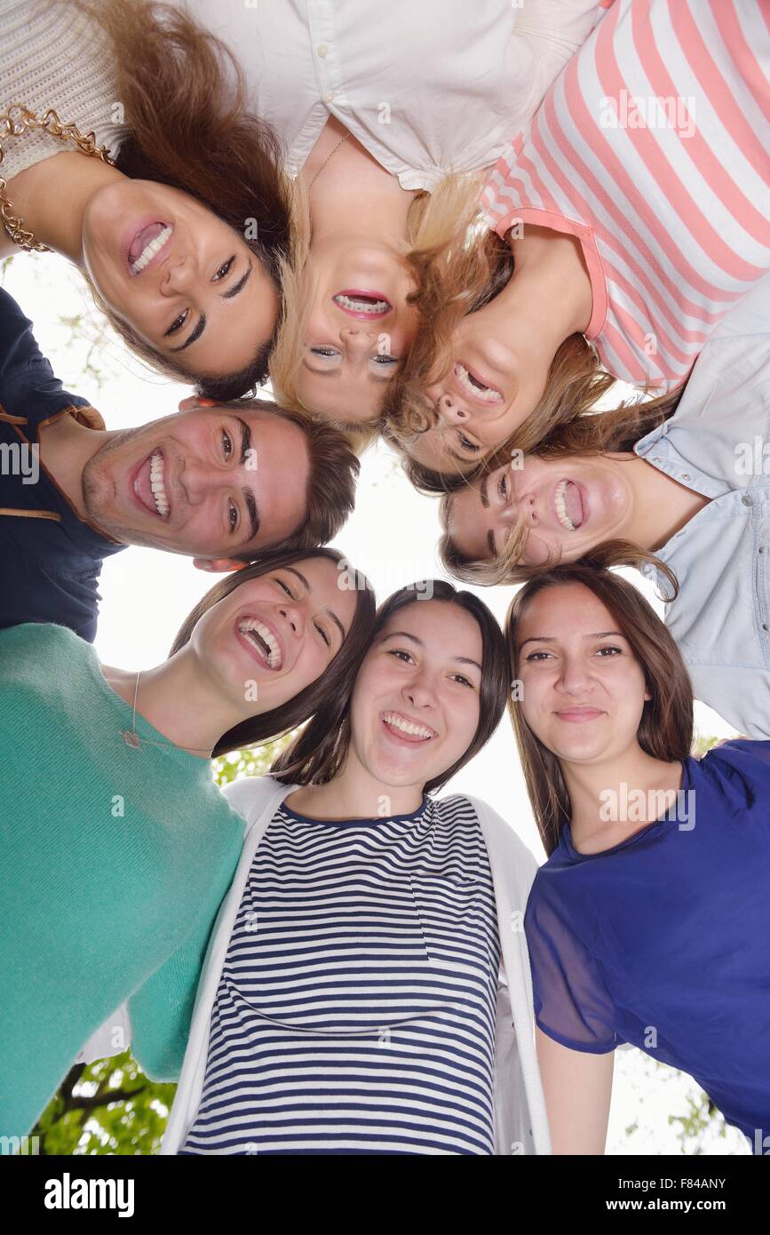 Happy smiling group of young friends staying together outdoor in the ...