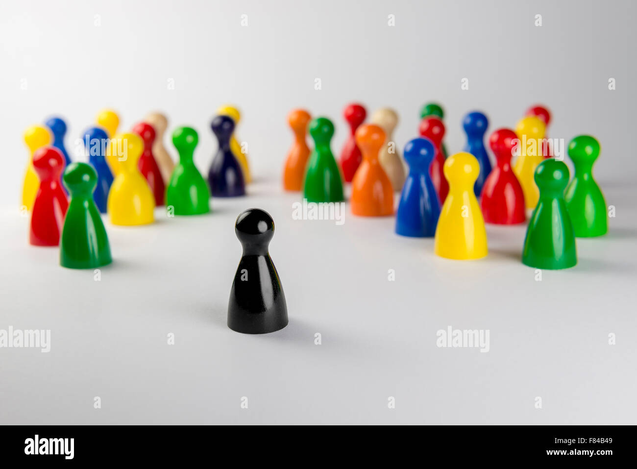 Conceptual game pawns that depict the concept different Stock Photo - Alamy