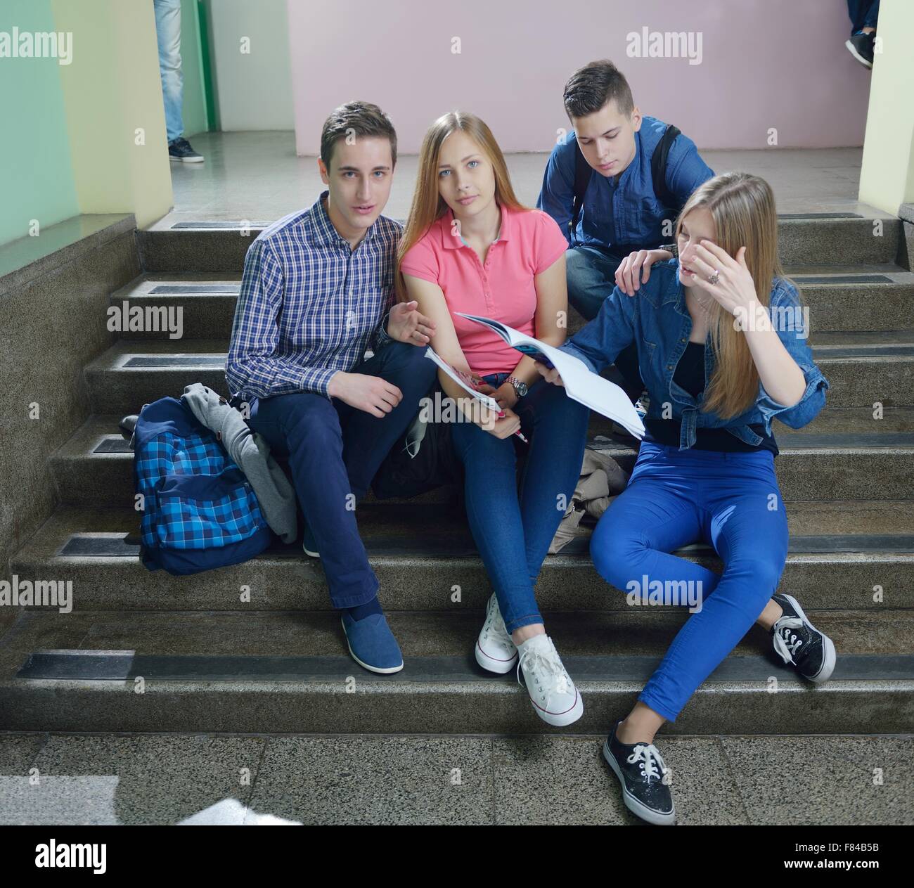 happy young teens group in school have fun an learning lessons Stock ...