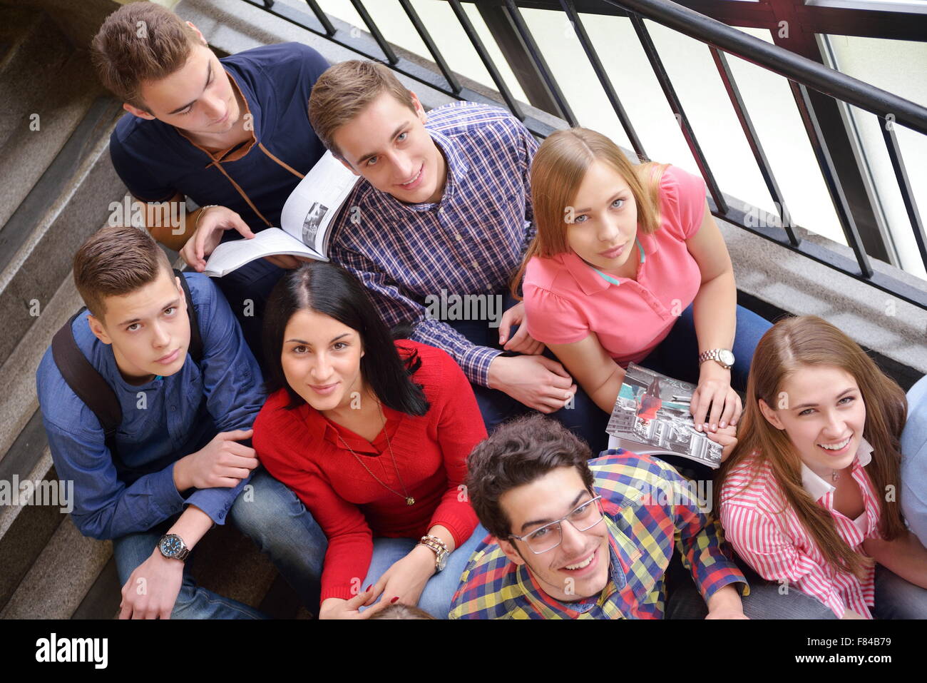 happy young teens group in school have fun an learning lessons Stock ...