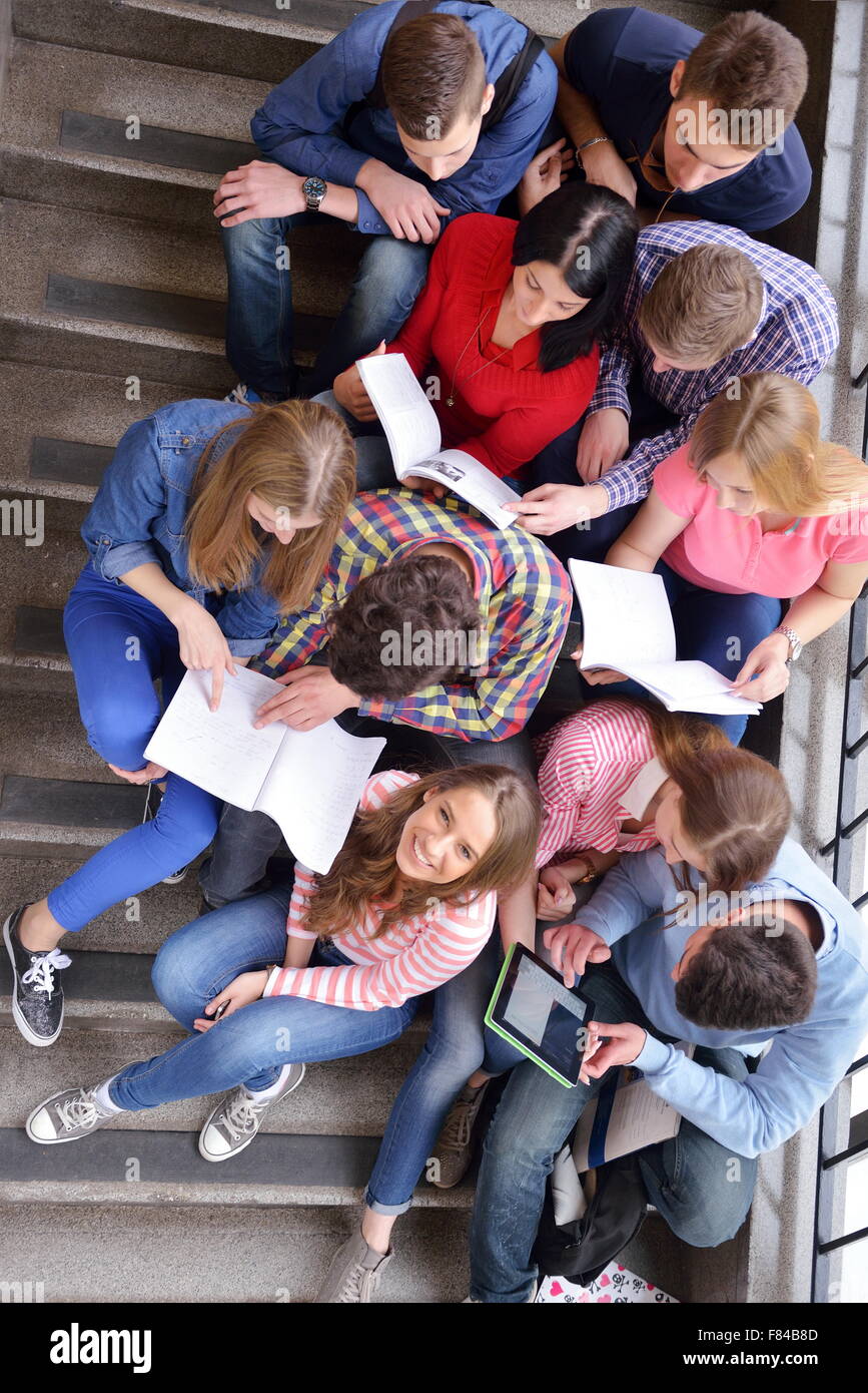 happy young teens group in school have fun an learning lessons Stock ...