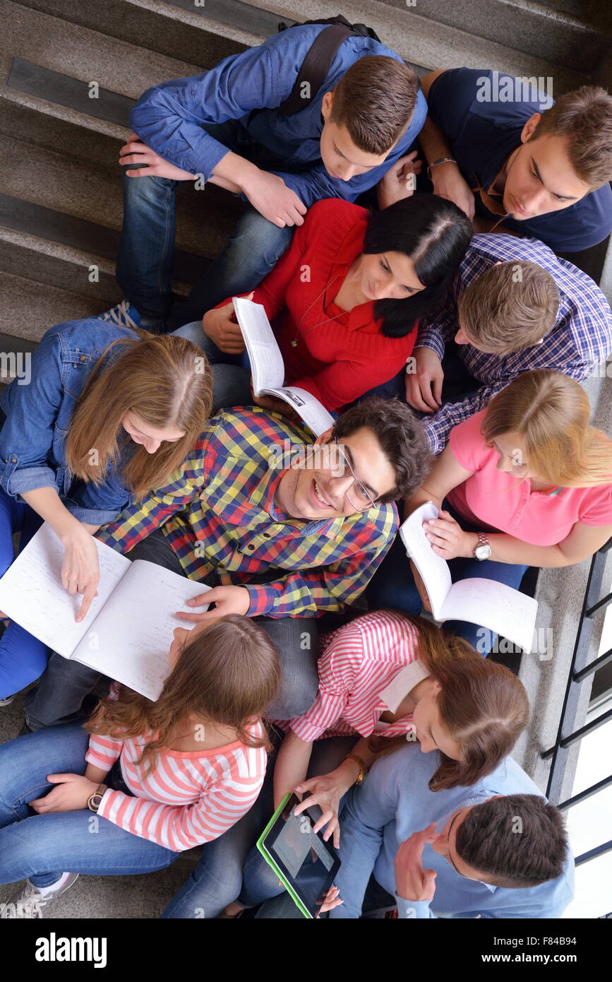 happy young teens group in school have fun an learning lessons Stock ...