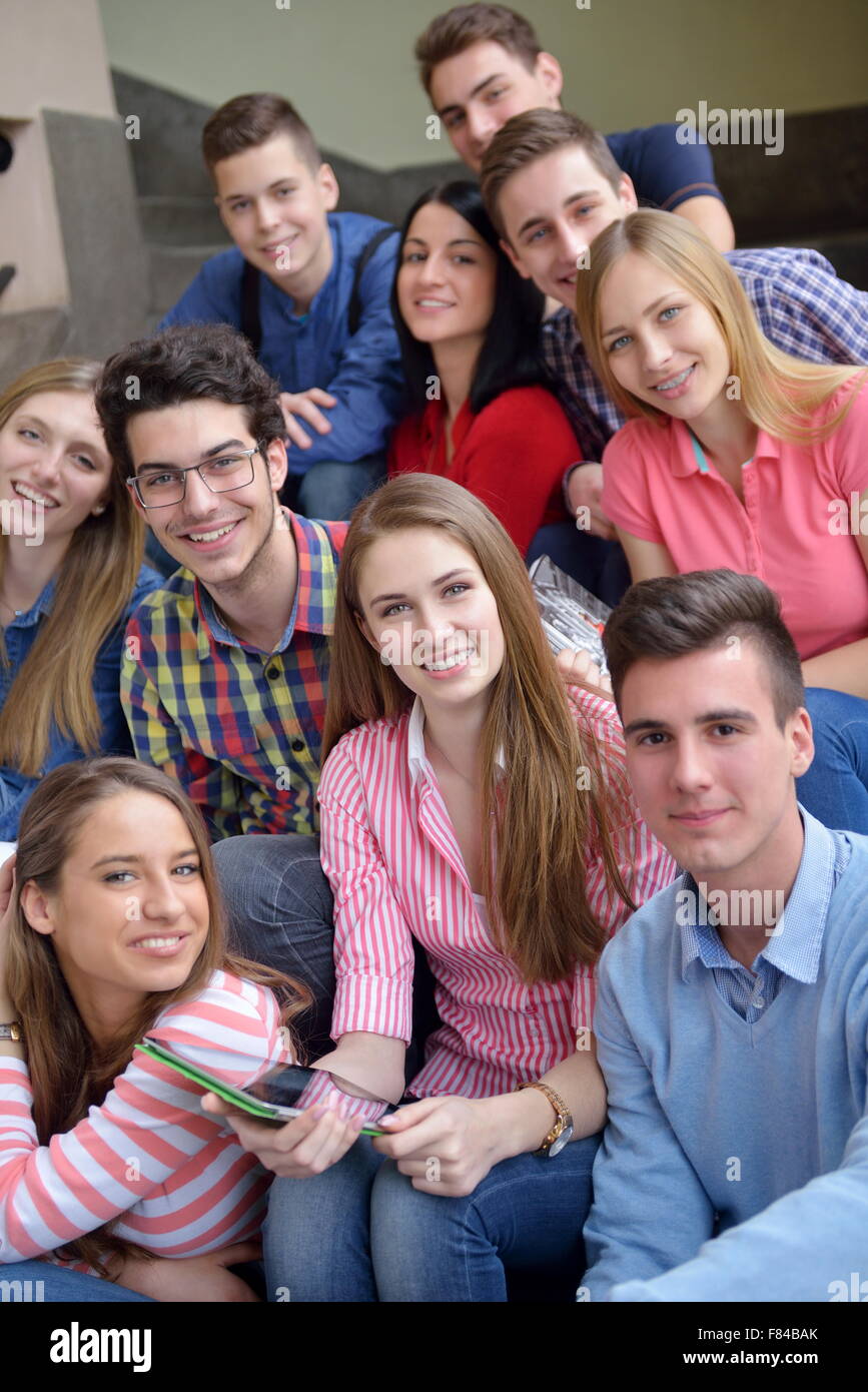 happy young teens group in school have fun an learning lessons Stock ...