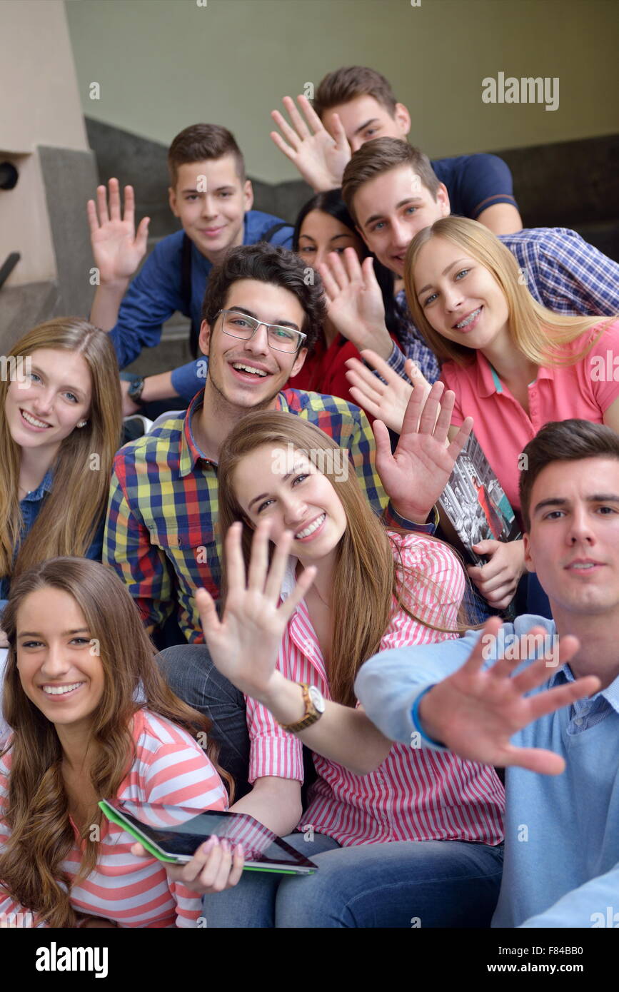 happy young teens group in school have fun an learning lessons Stock ...