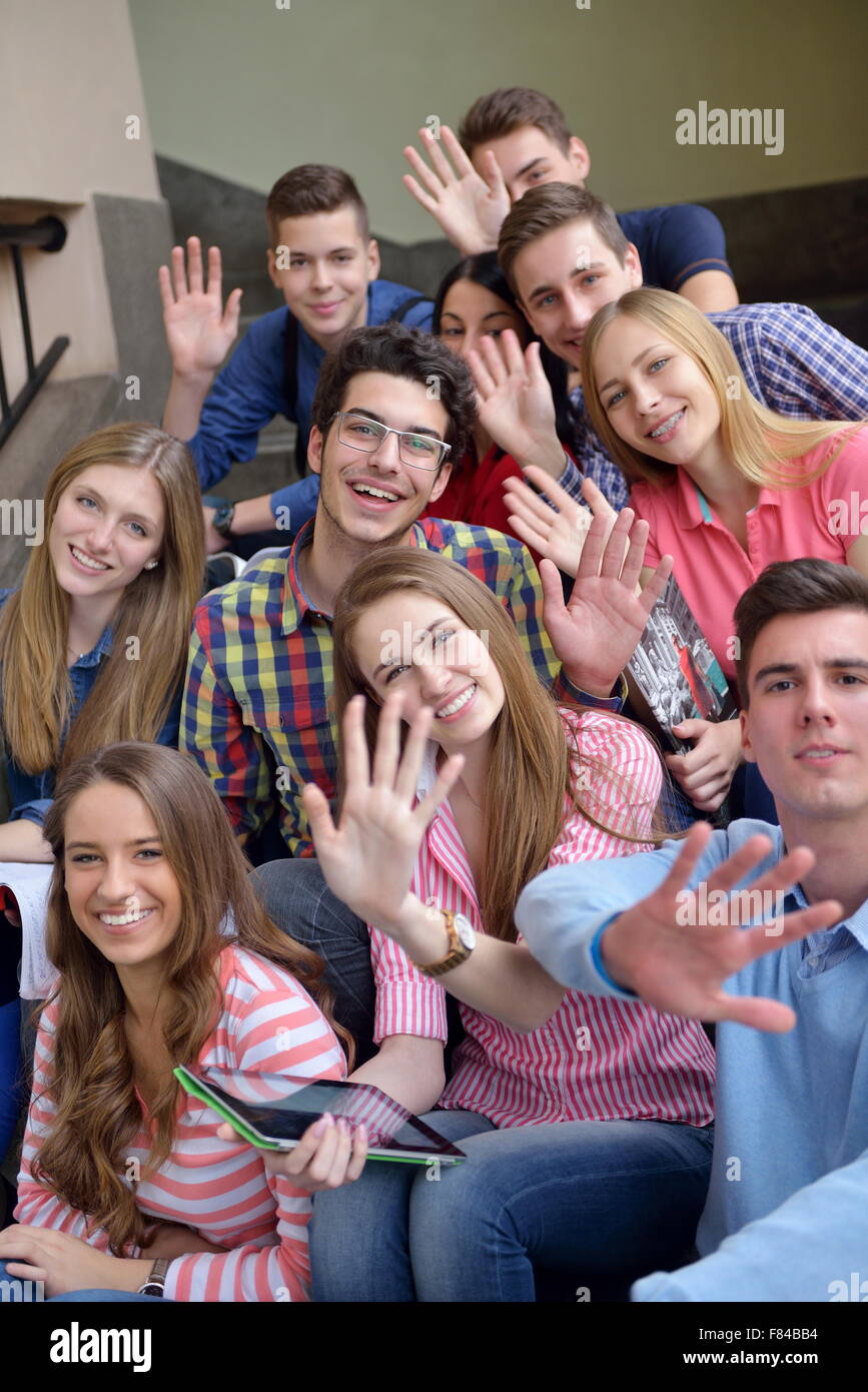 happy young teens group in school have fun an learning lessons Stock ...