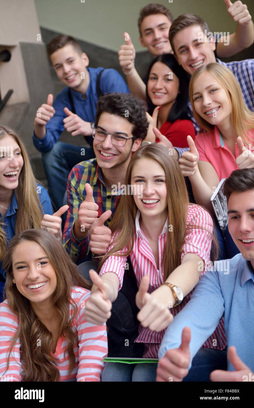 happy young teens group in school have fun an learning lessons Stock ...