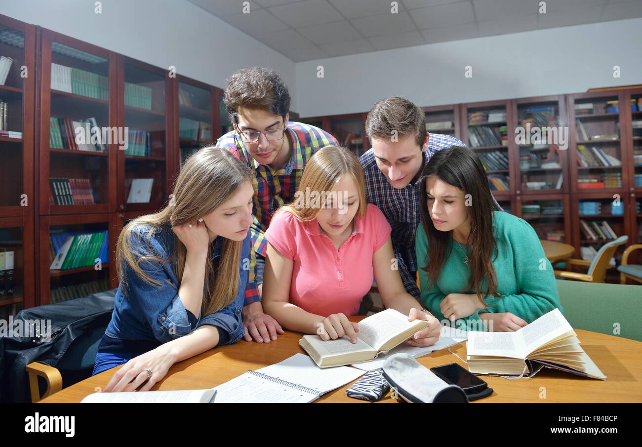 happy young teens group in school have fun an learning lessons Stock ...