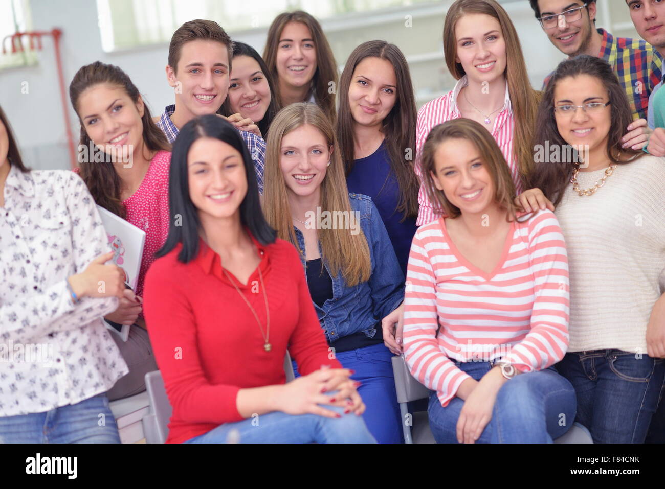 happy young teens group in school have fun an learning lessons Stock ...