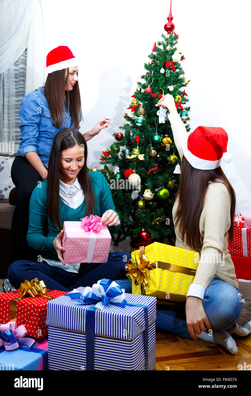 giving and opening gifts at Christmas Stock Photo - Alamy