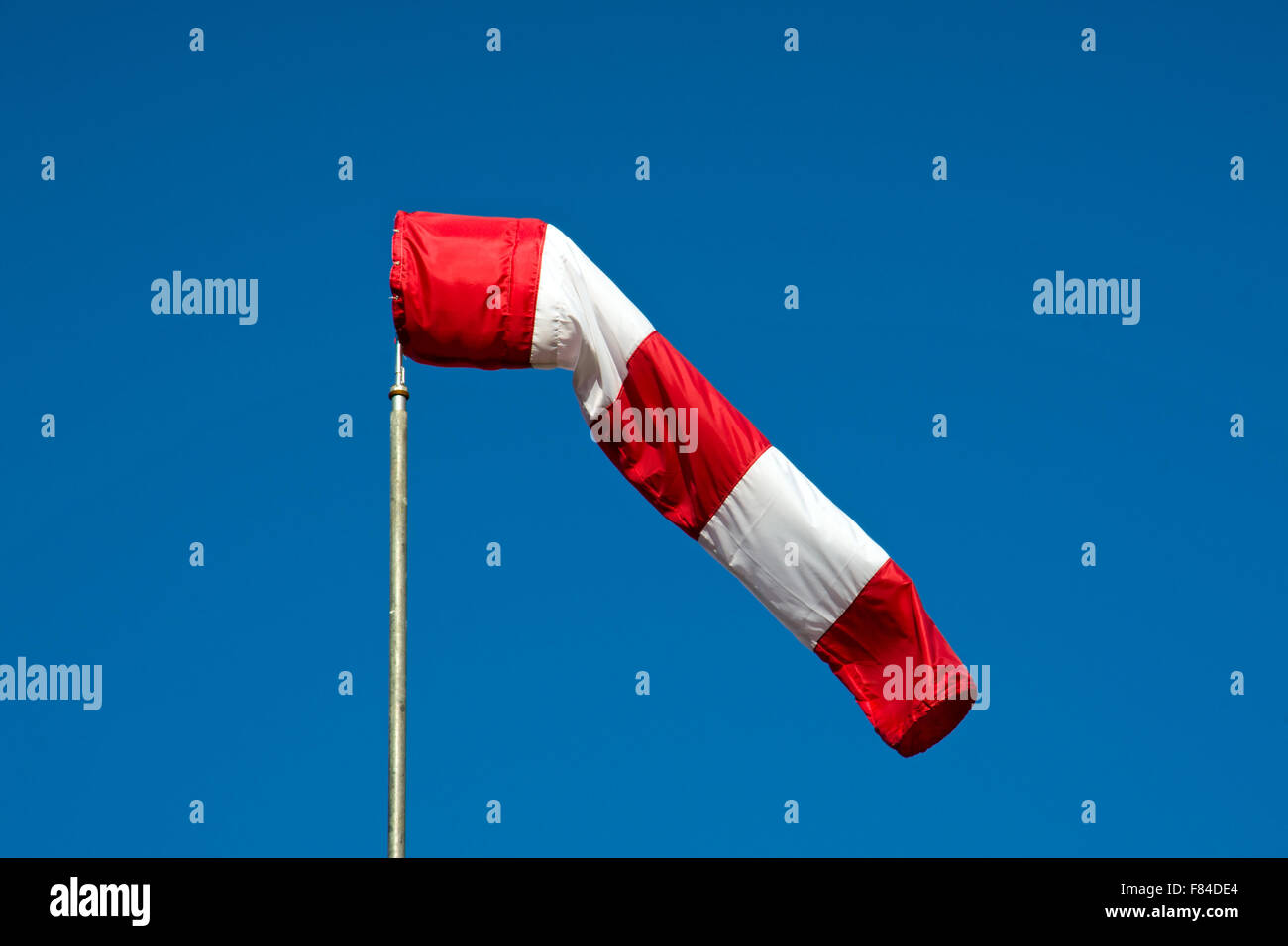 A windsock with red and white stripes Stock Photo - Alamy