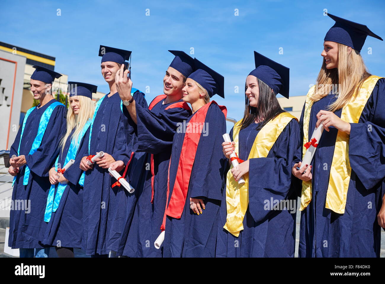 young graduates students group standing in front of university building ...