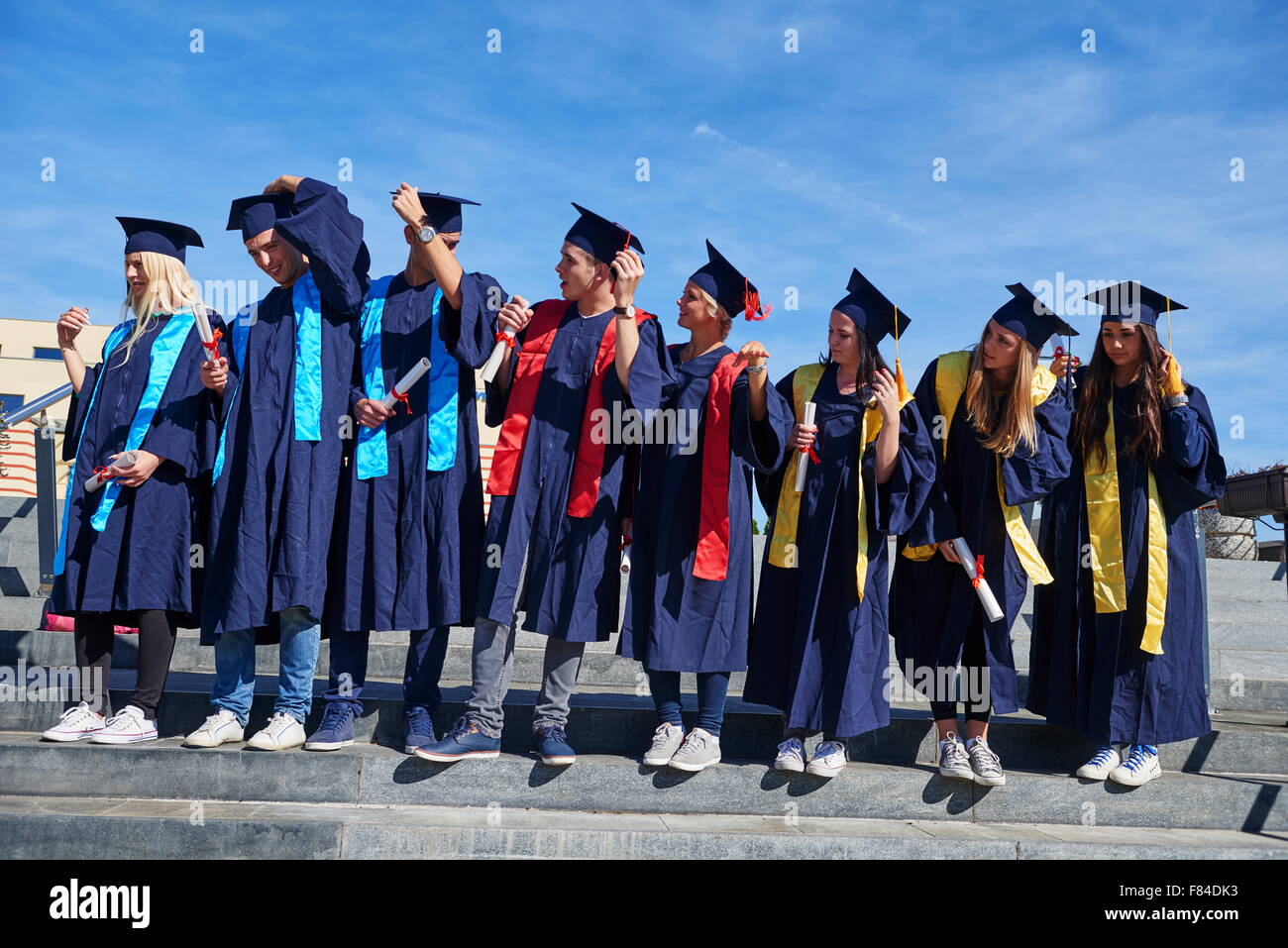 young graduates students group standing in front of university building ...