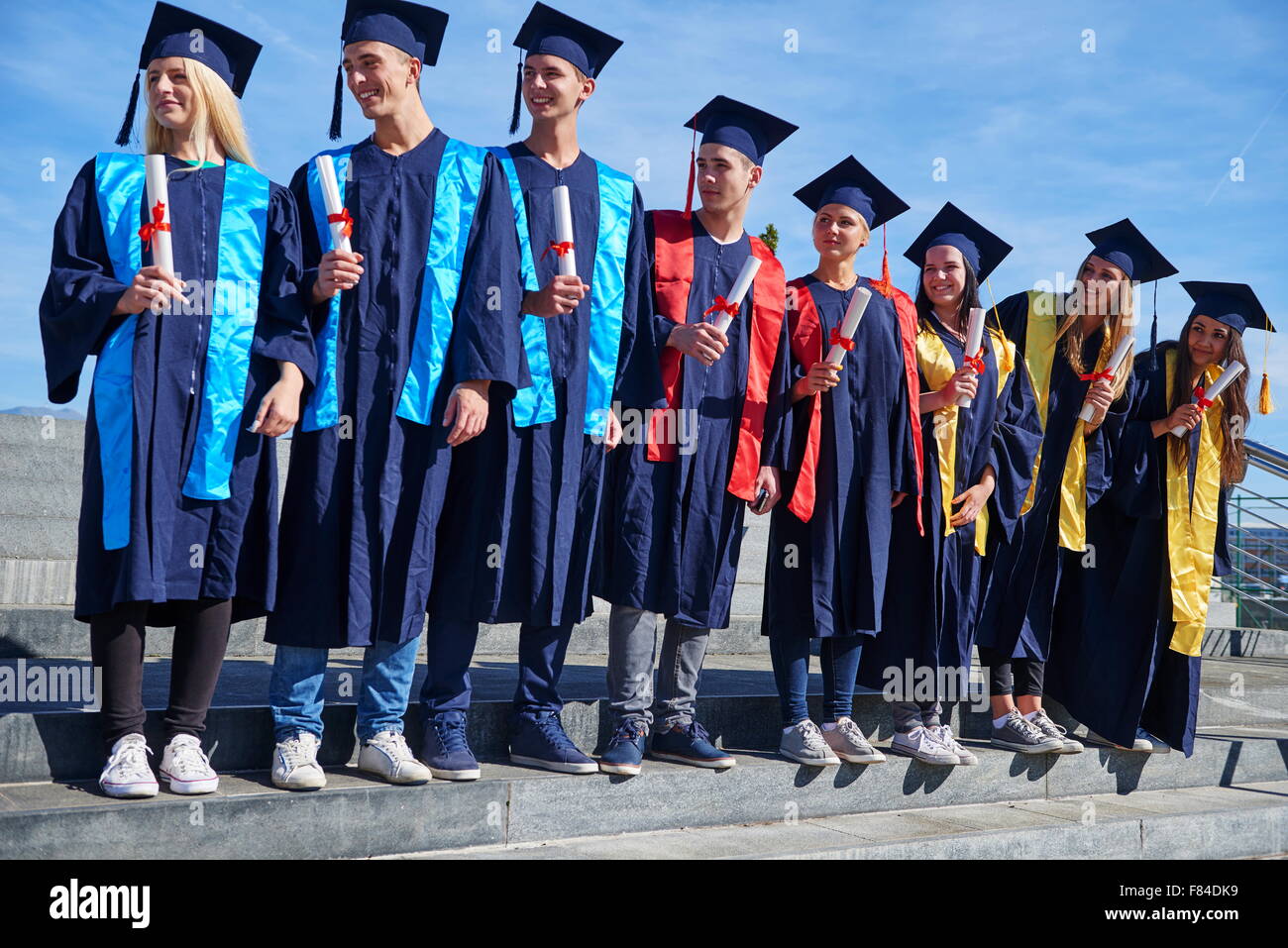 young graduates students group standing in front of university building ...