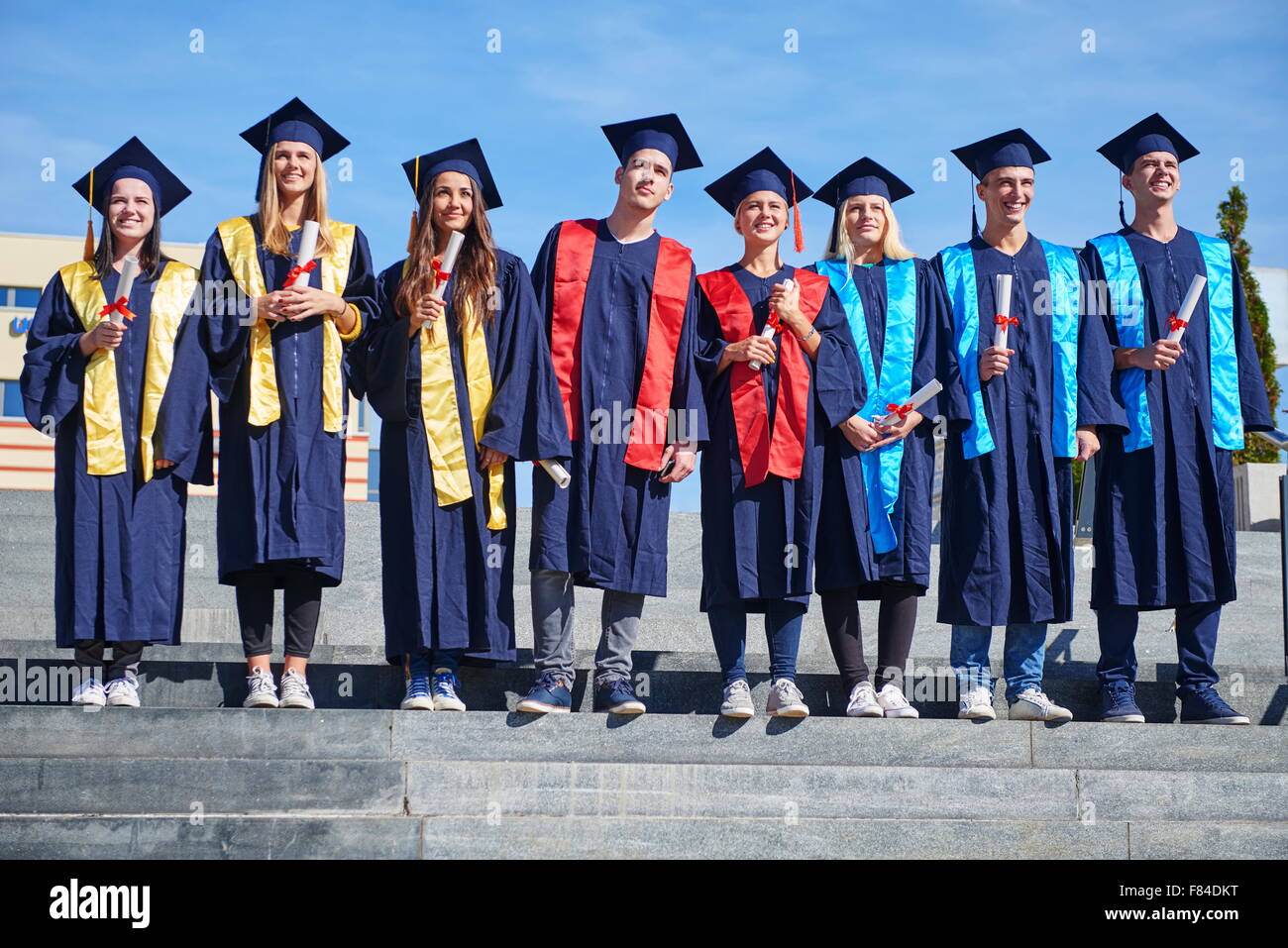 young graduates students group standing in front of university building ...