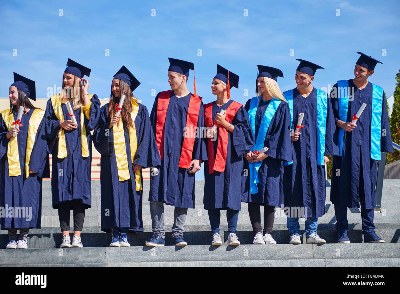 young graduates students group standing in front of university building ...