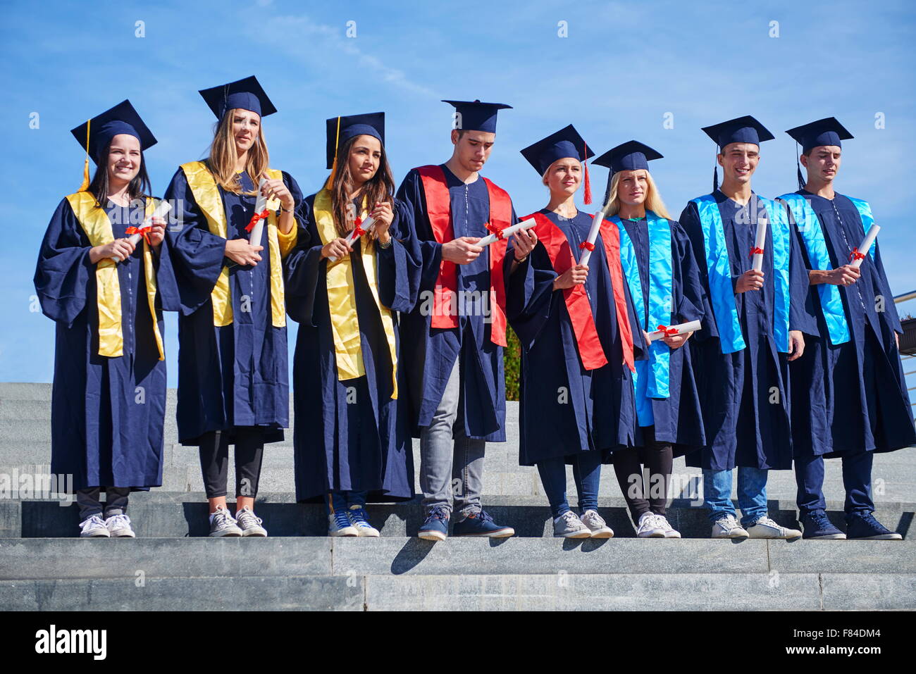 young graduates students group standing in front of university building ...