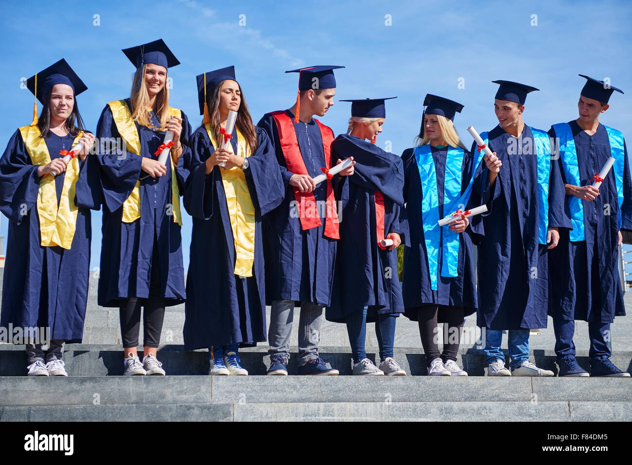 young graduates students group standing in front of university building ...