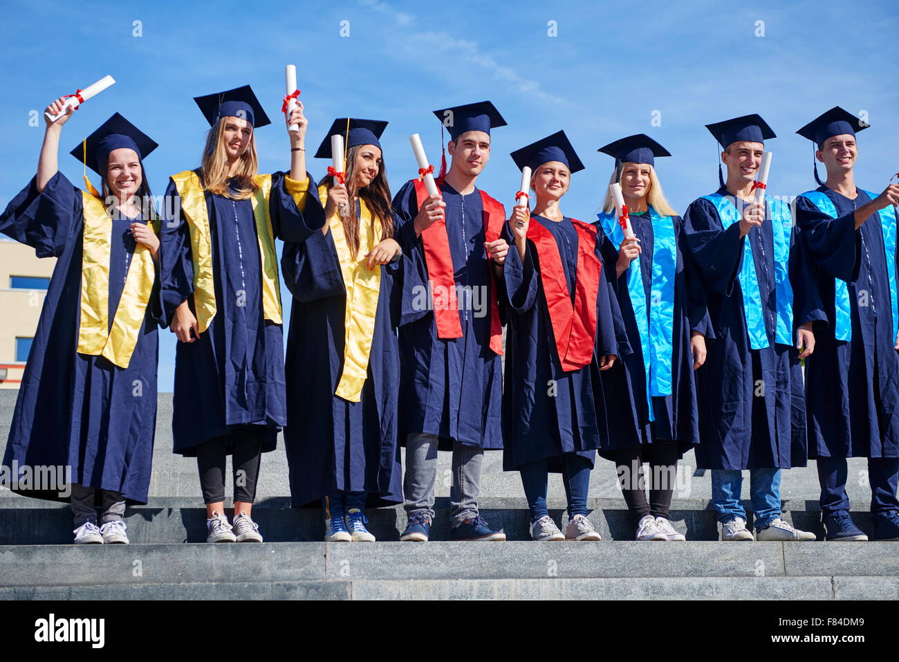 young graduates students group standing in front of university building ...
