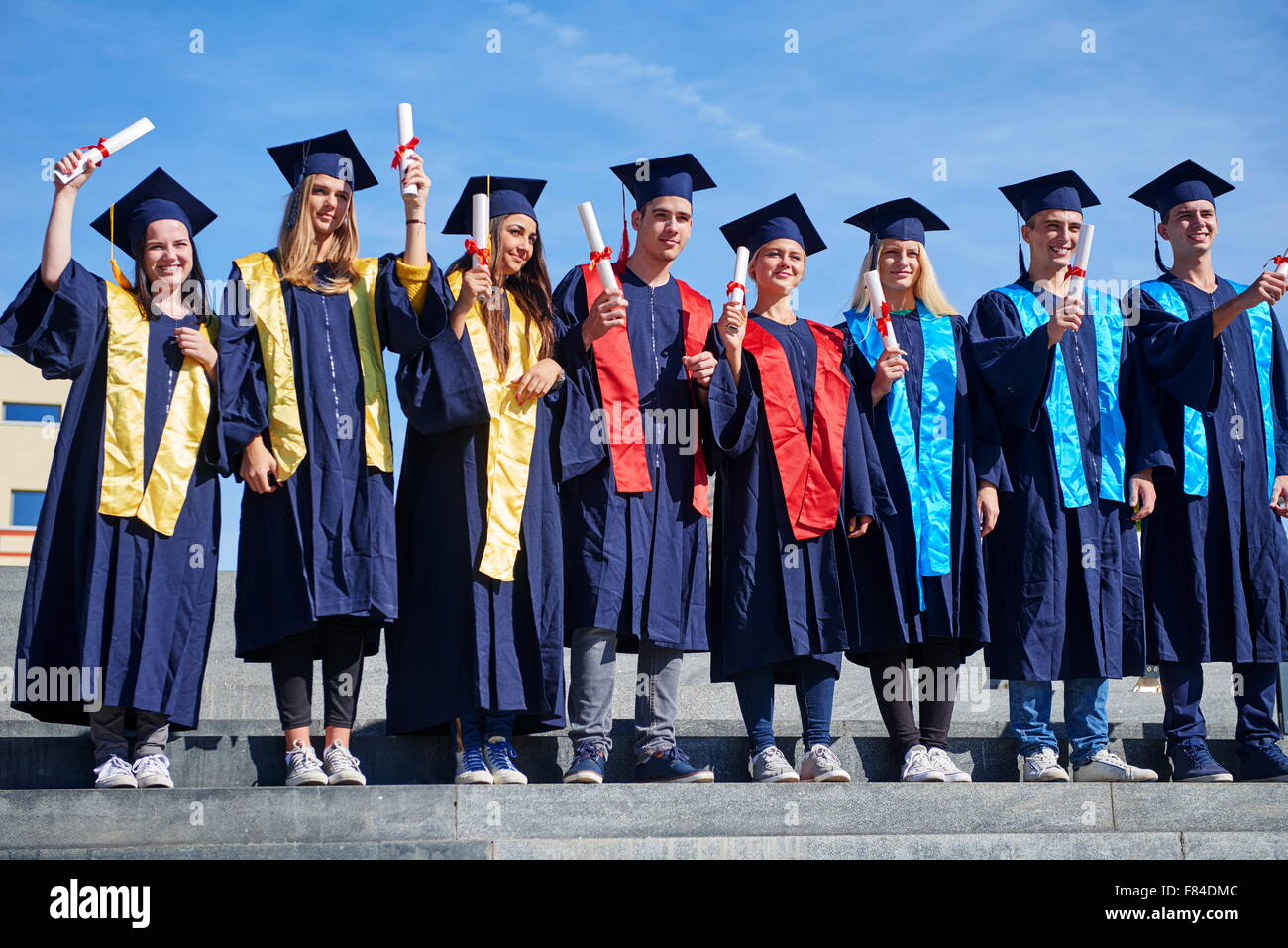 young graduates students group standing in front of university building ...