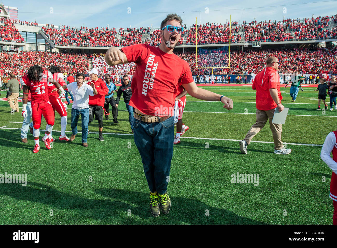 Houston, TX, USA. 5th Dec, 2015. Fans rush the field after the American ...