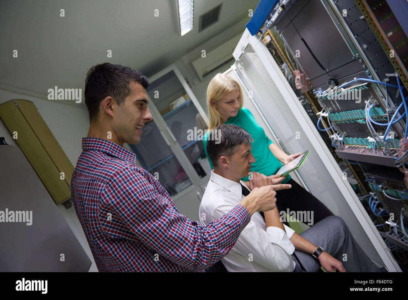 business people group, network engeneers working in network server room ...