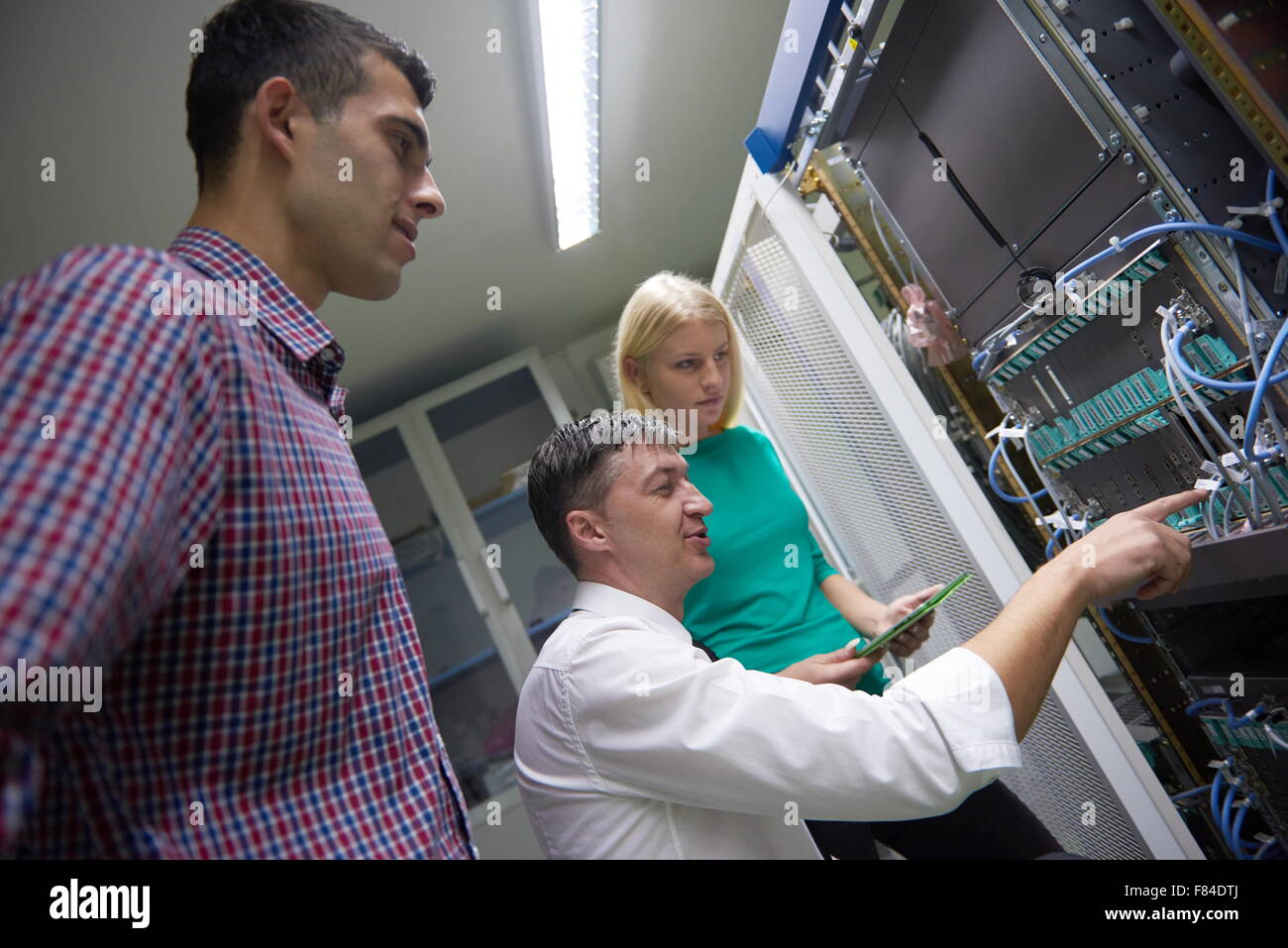 business people group, network engeneers working in network server room ...