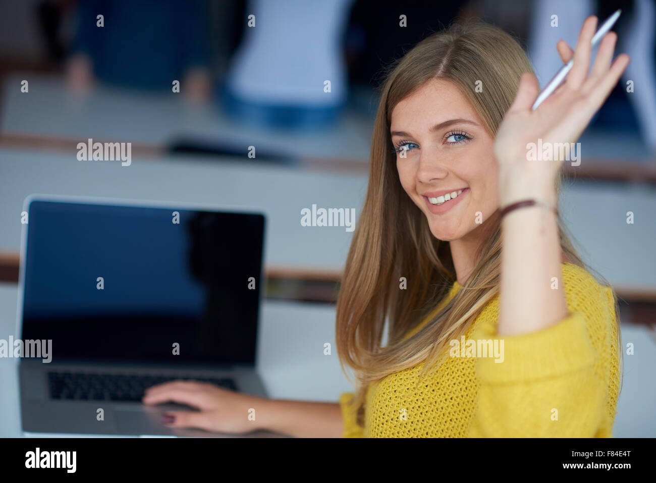 portrait of happy smilling student girl at tech classroom with laptop ...