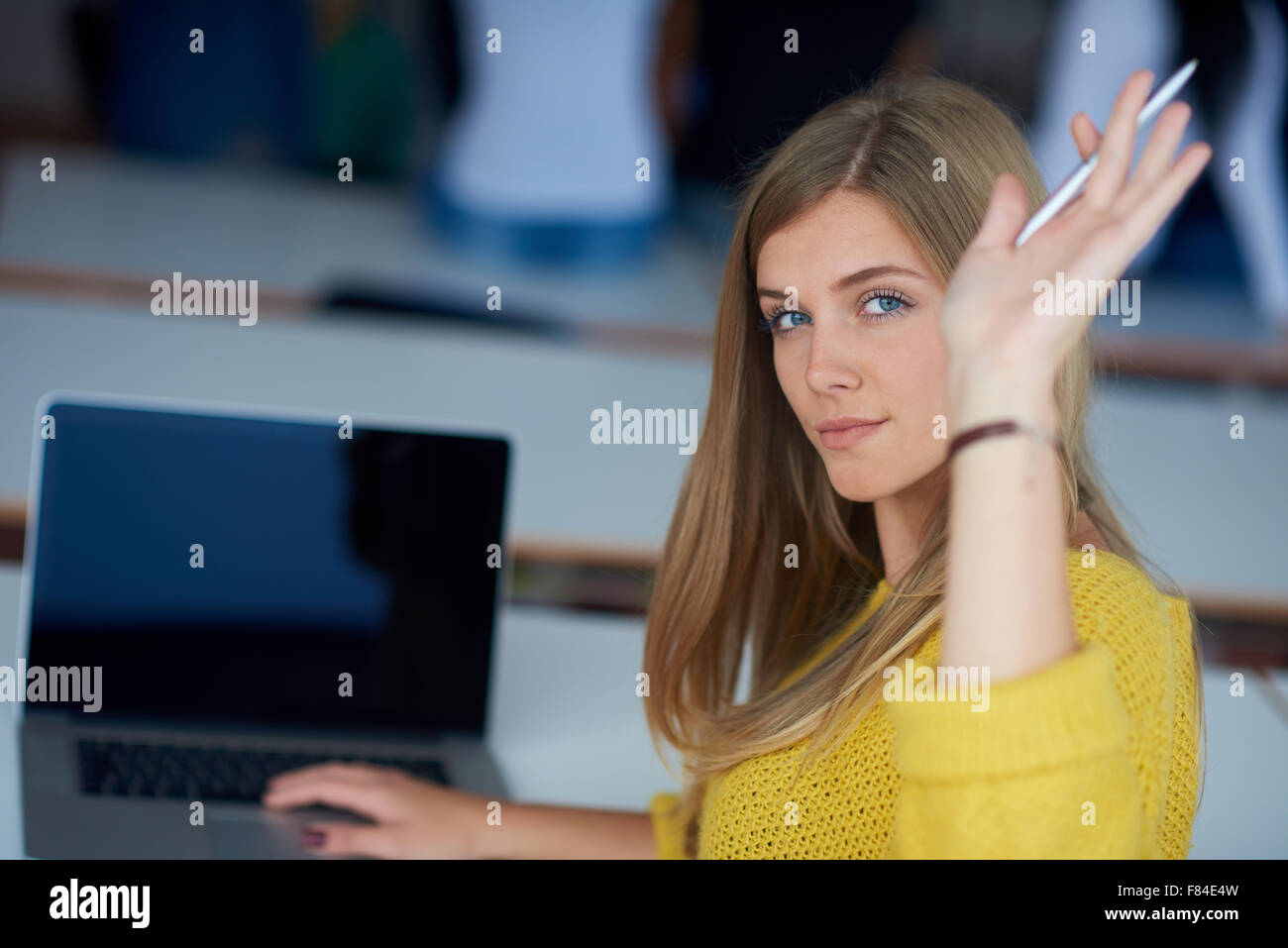 portrait of happy smilling student girl at tech classroom with laptop ...