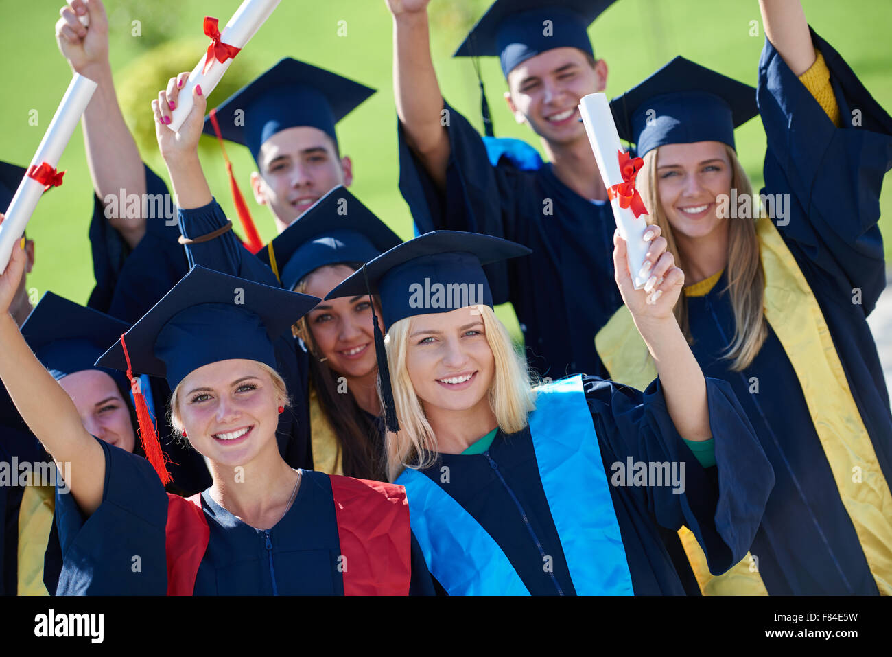 young graduates students group standing in front of university building ...