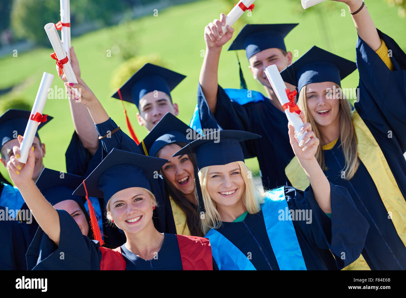 young graduates students group standing in front of university building ...