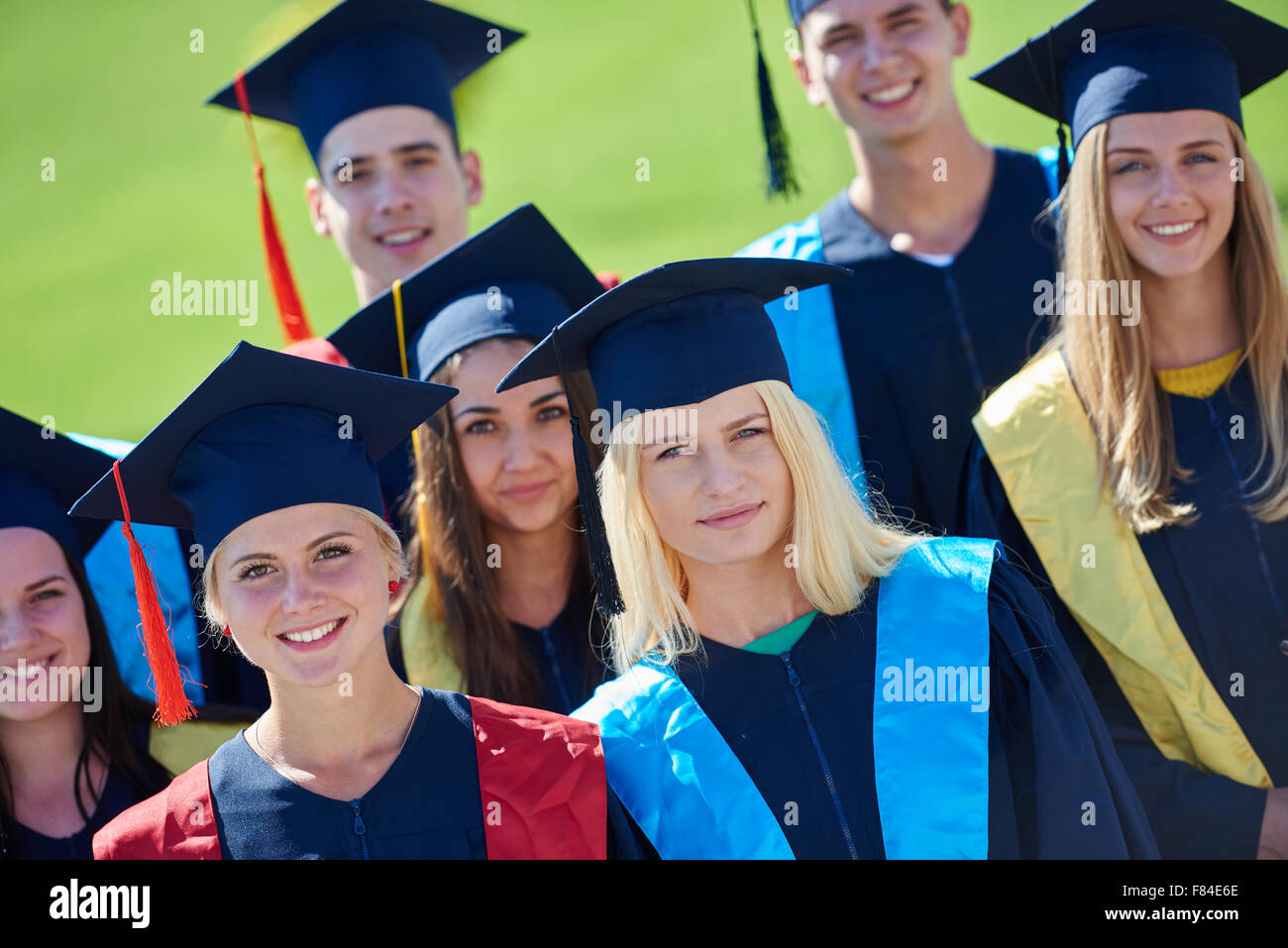 young graduates students group standing in front of university building ...