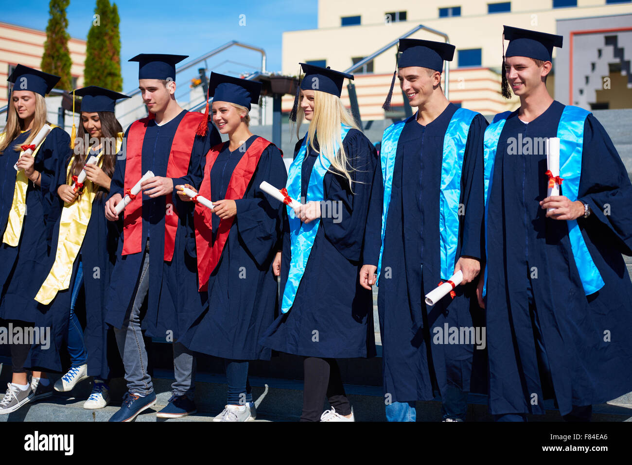 young graduates students group standing in front of university building ...