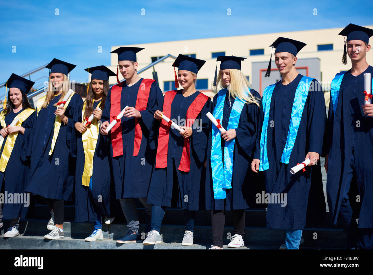young graduates students group standing in front of university building ...