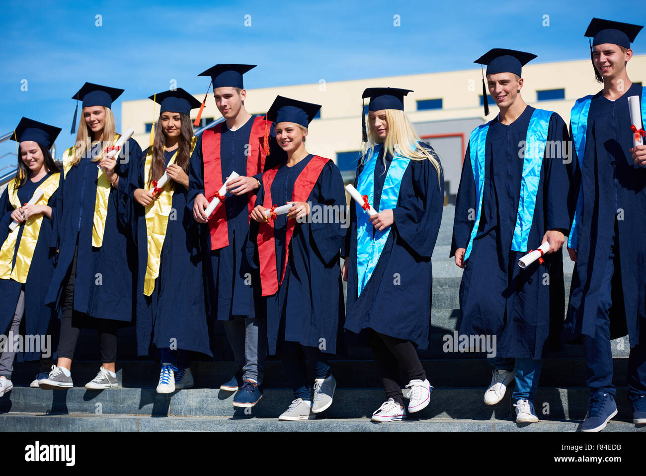young graduates students group standing in front of university building ...