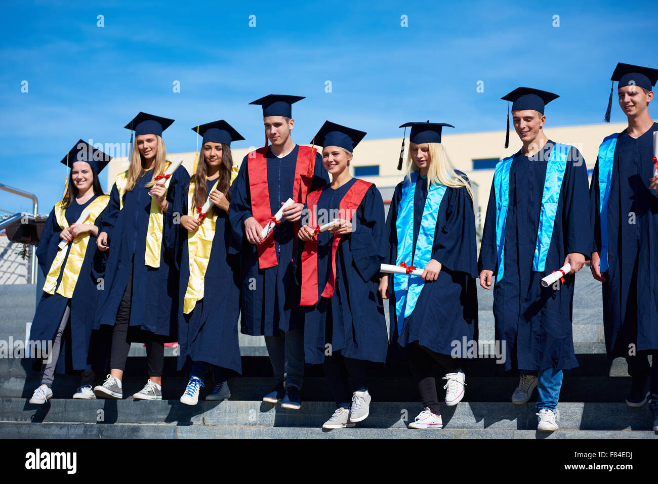 young graduates students group standing in front of university building ...