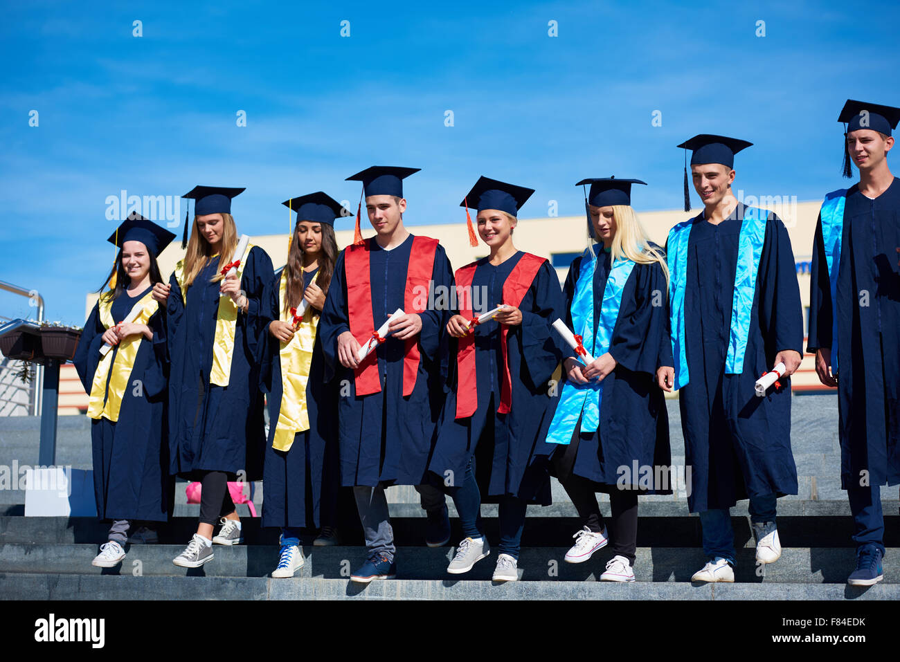 young graduates students group standing in front of university building ...