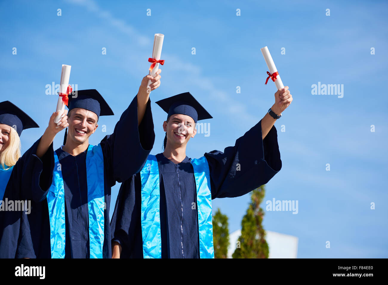 young graduates students group standing in front of university building ...