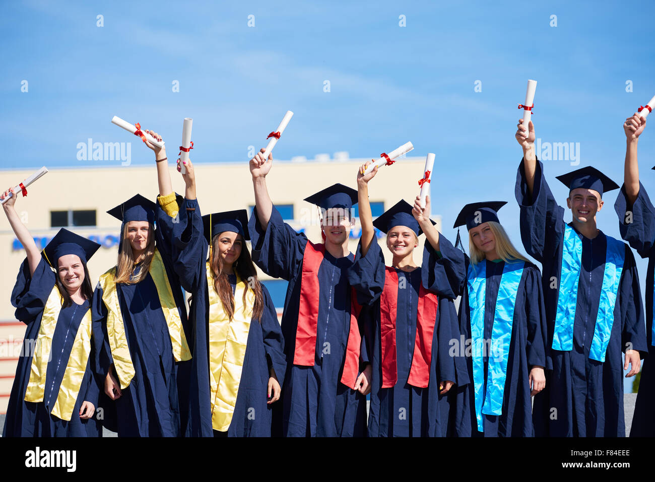 young graduates students group standing in front of university building ...
