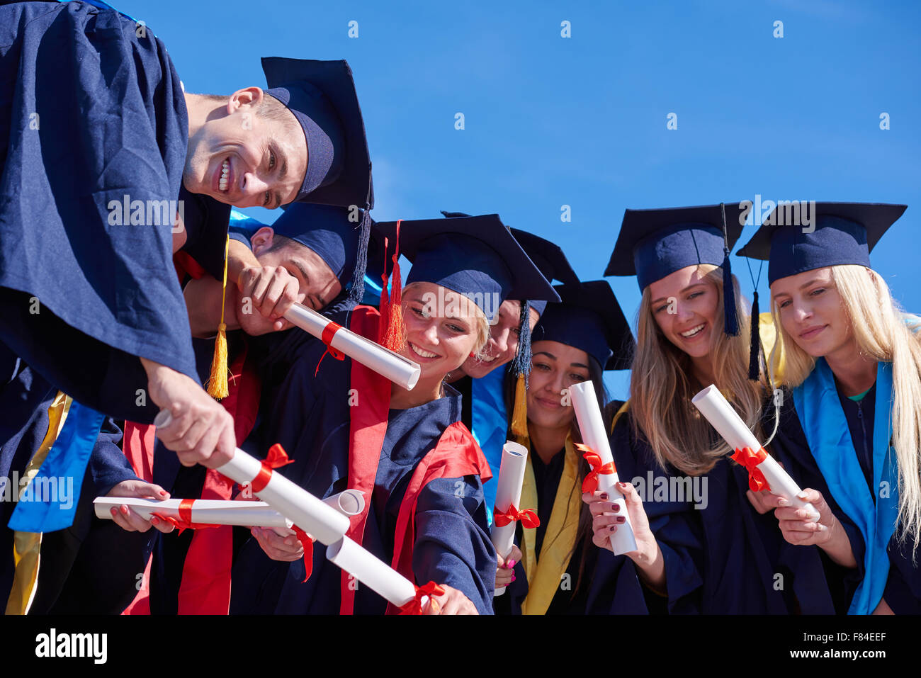 young graduates students group standing in front of university building ...