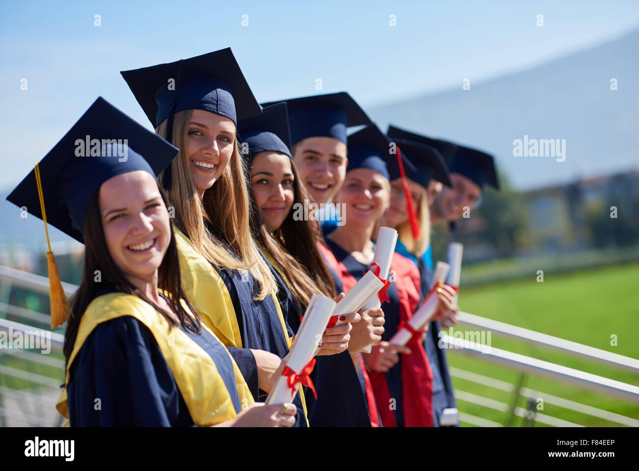 young graduates students group standing in front of university building ...