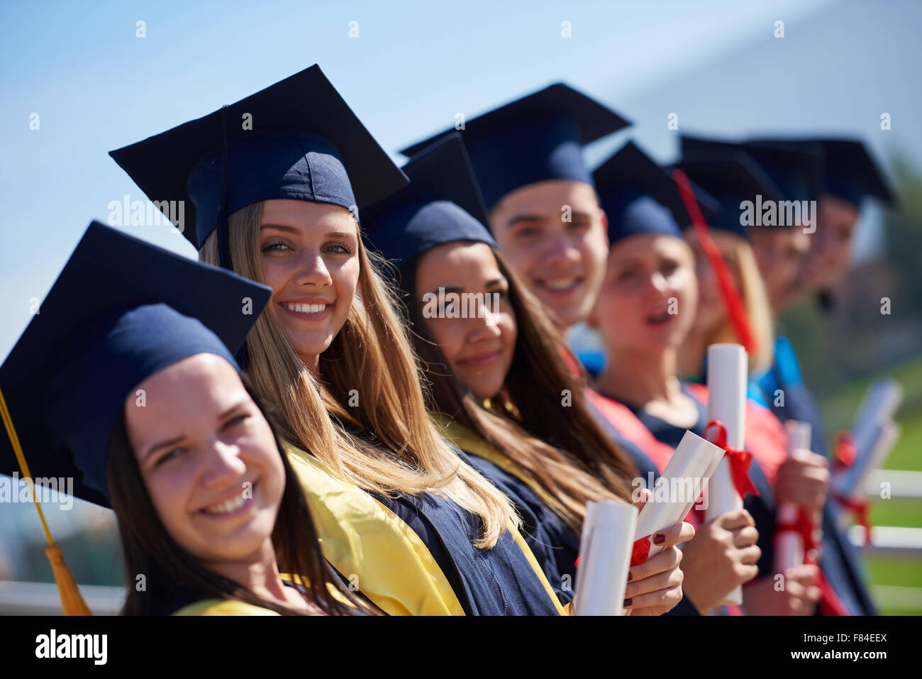 young graduates students group standing in front of university building ...