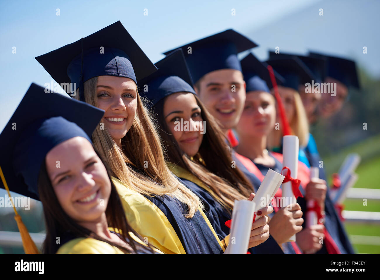 young graduates students group standing in front of university building ...