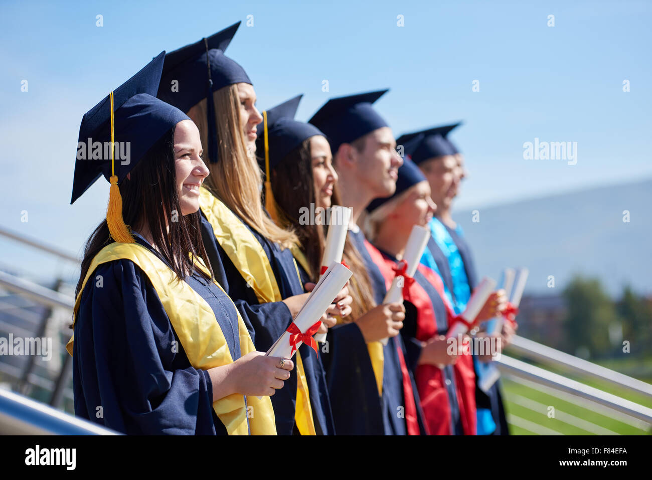 young graduates students group standing in front of university building ...