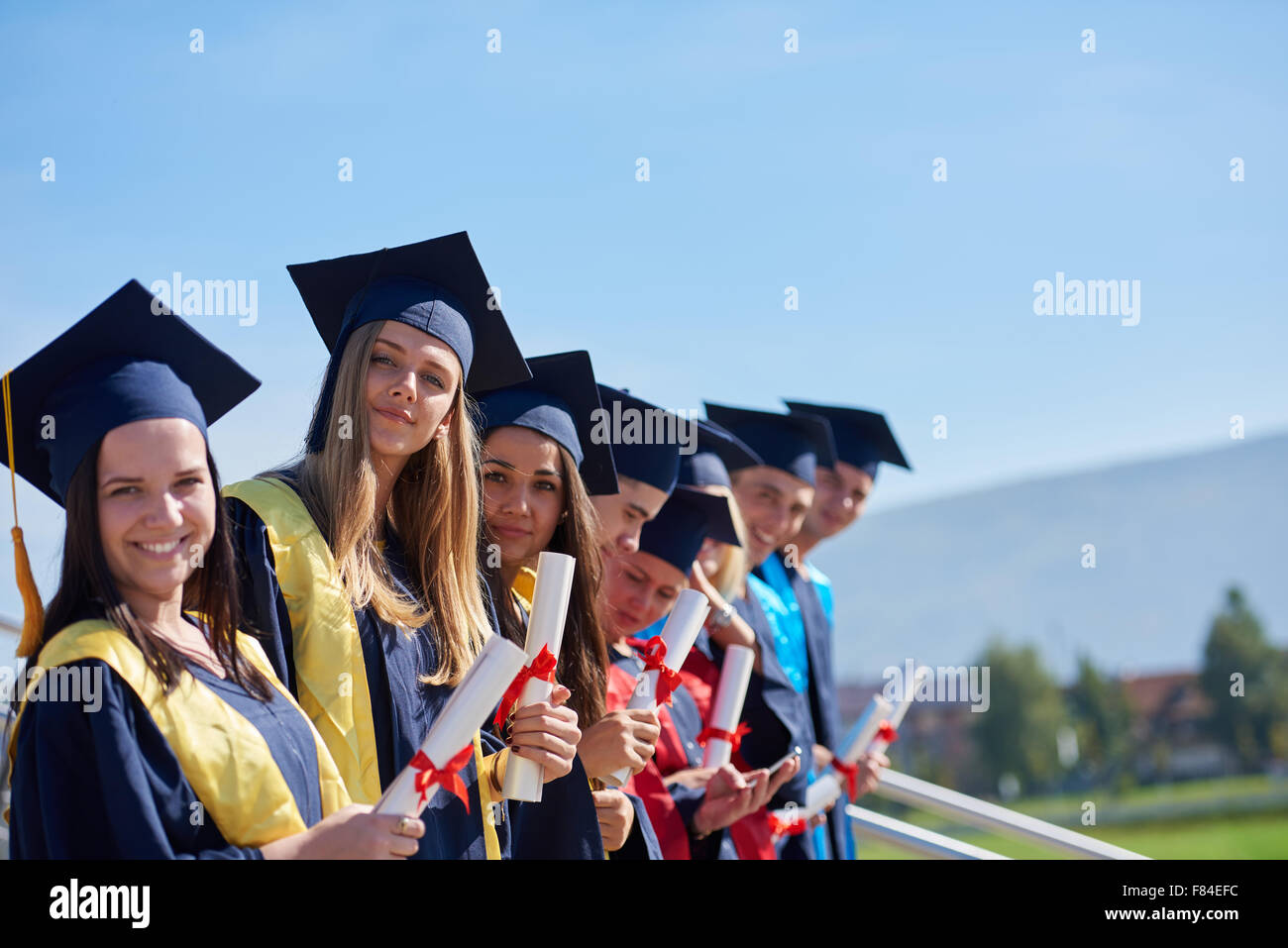 young graduates students group standing in front of university building ...
